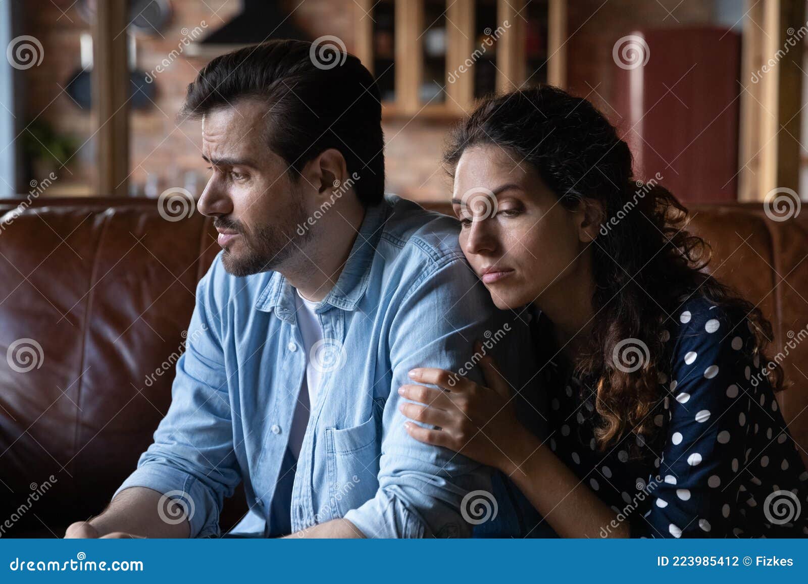 Wife Expressing Empathy And Compassion To Sad Frustrated Husband Stock