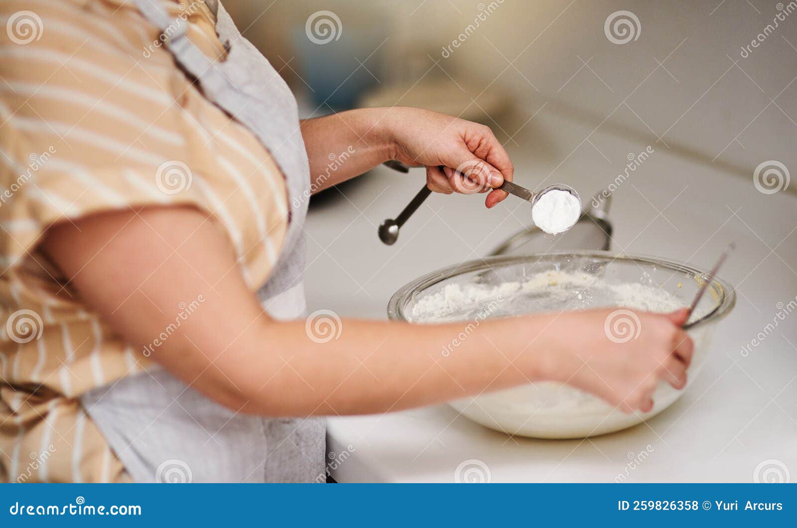 This Will Make it Fluffy and Big. an Unrecognizable Woman Adding Baking ...