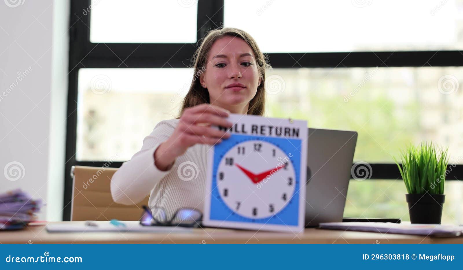 Will Return Sign is on Table and Female Manager is Leaving Workplace in ...