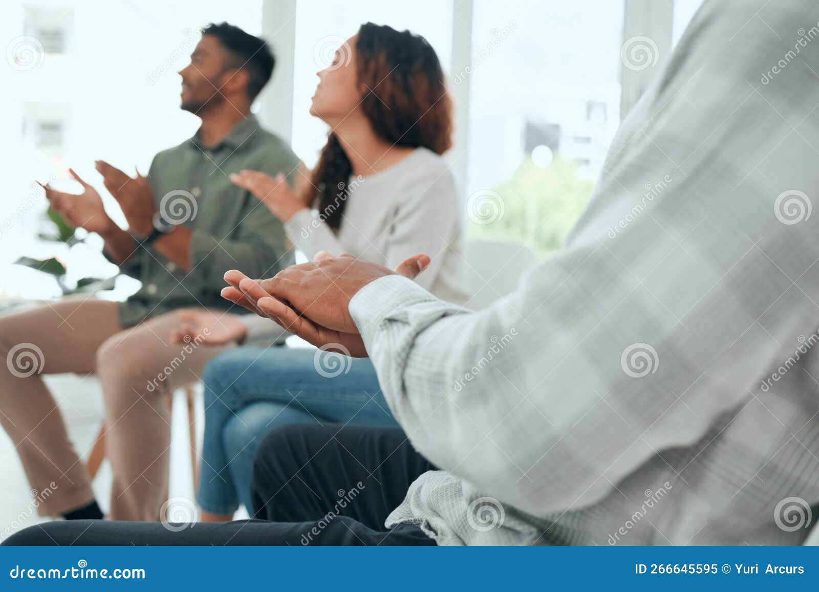 We Win Together. an Unrecognisable Group of People Sitting Together and ...