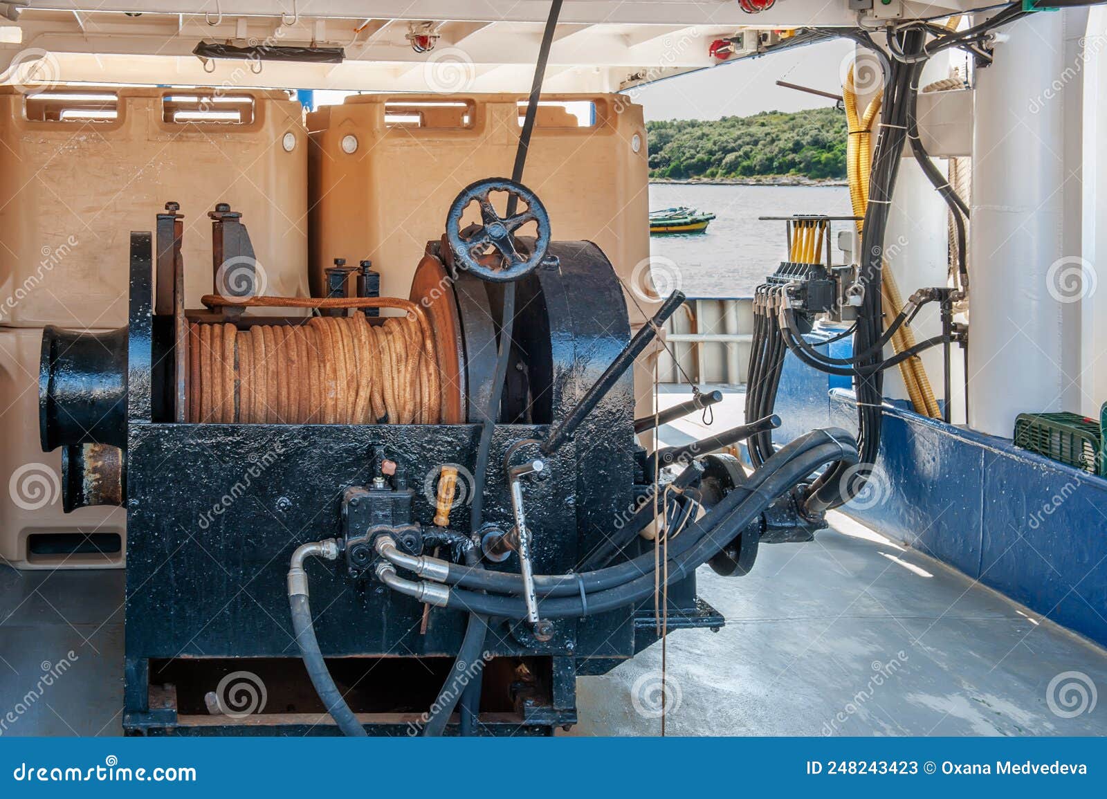 Winch with a Rope on the Deck of the Ship. a Coiled Rope at the Base of ...
