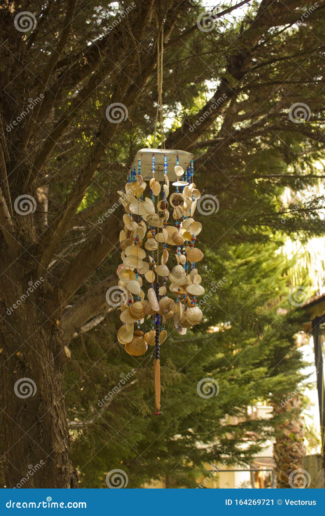 Wind bell hung on a tree stock image. Image of bell - 164269721