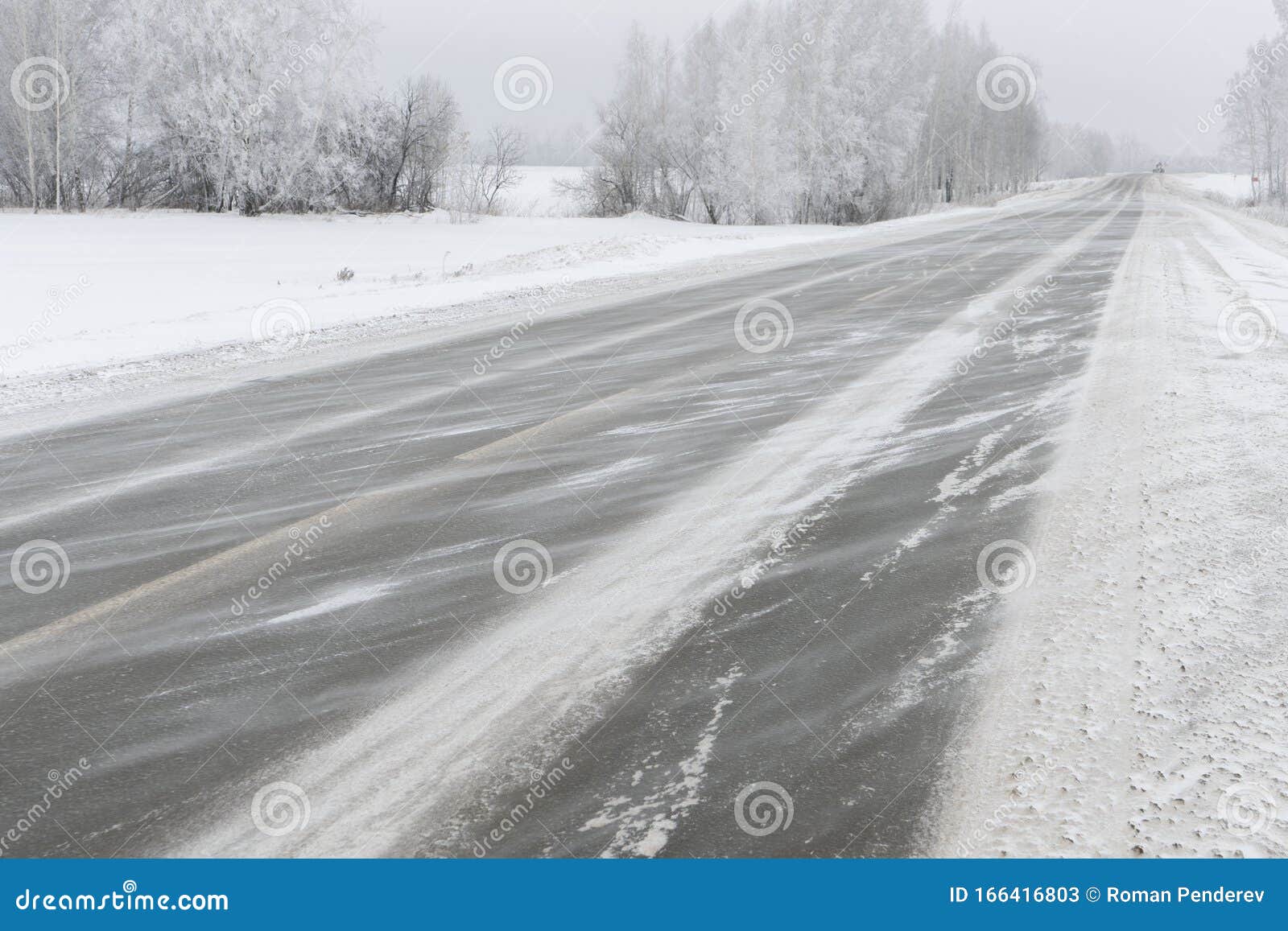 The Wind Blows Off the Snow Along the Highway Stock Image - Image of ...