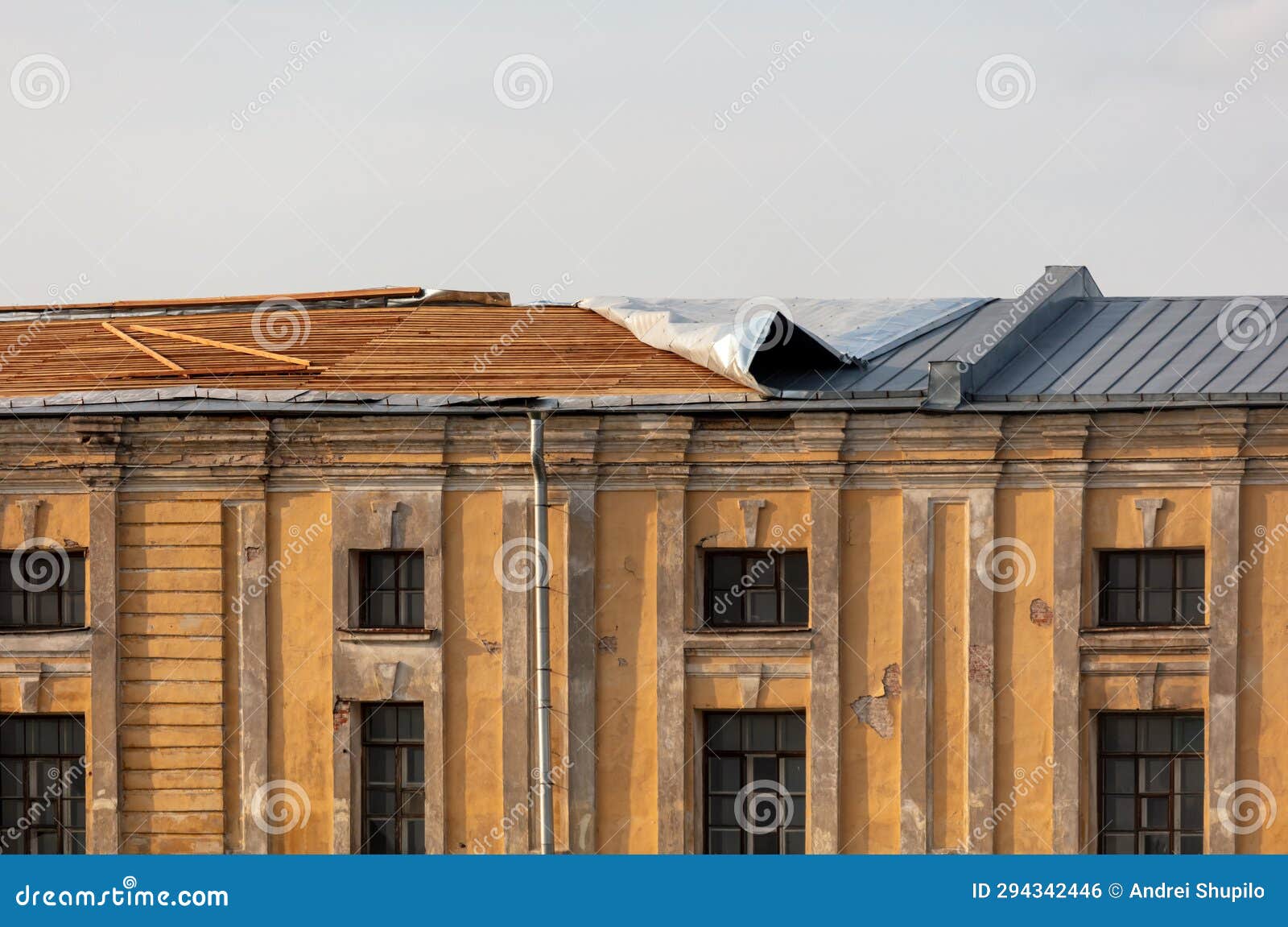 Wind-damaged Roof of a Building Stock Photo - Image of rooftop, blow ...