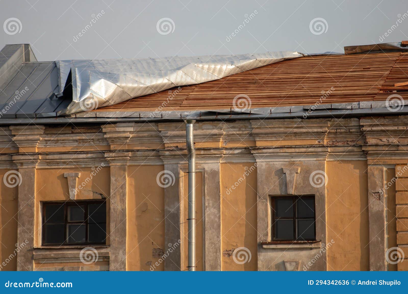 Wind-damaged Roof of a Building Stock Photo - Image of tile, wind ...