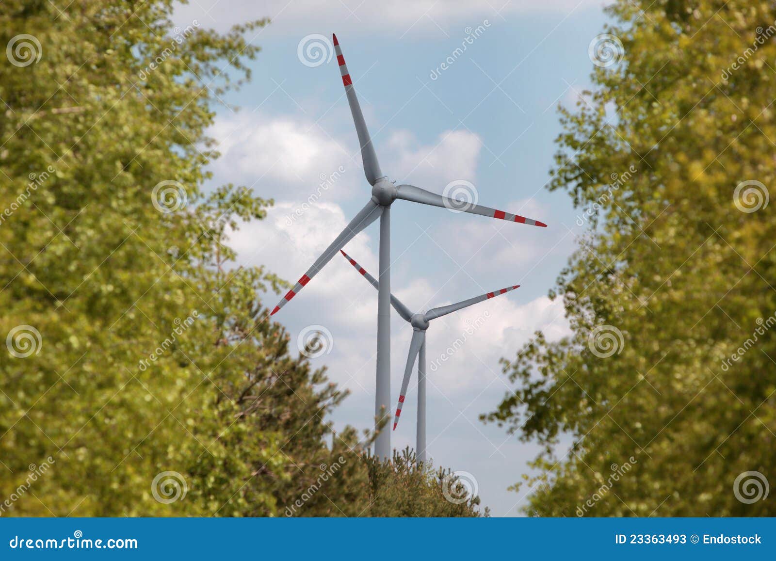 Wind Energy Turbines among Trees Stock Image - Image of electric, plant ...