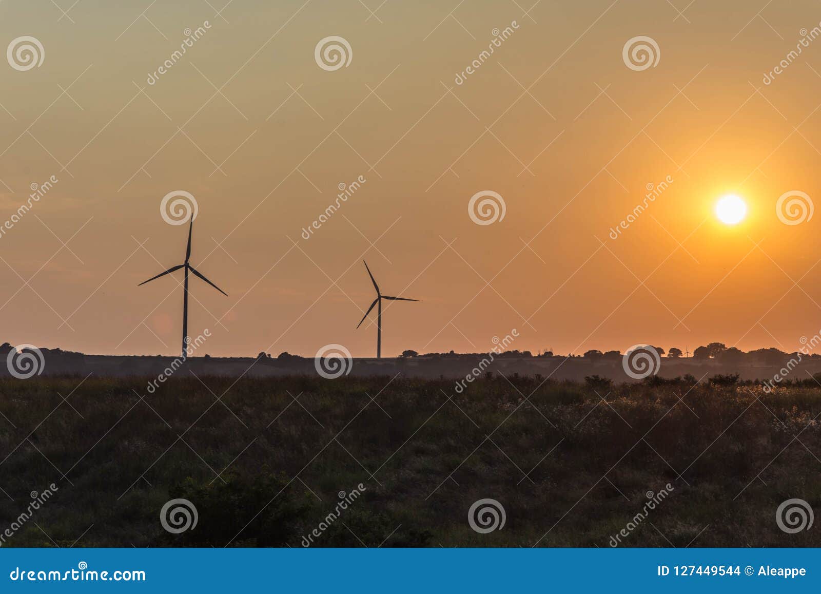 Wind Farm at Sunset in Italy Stock Photo - Image of reflection, clouds ...