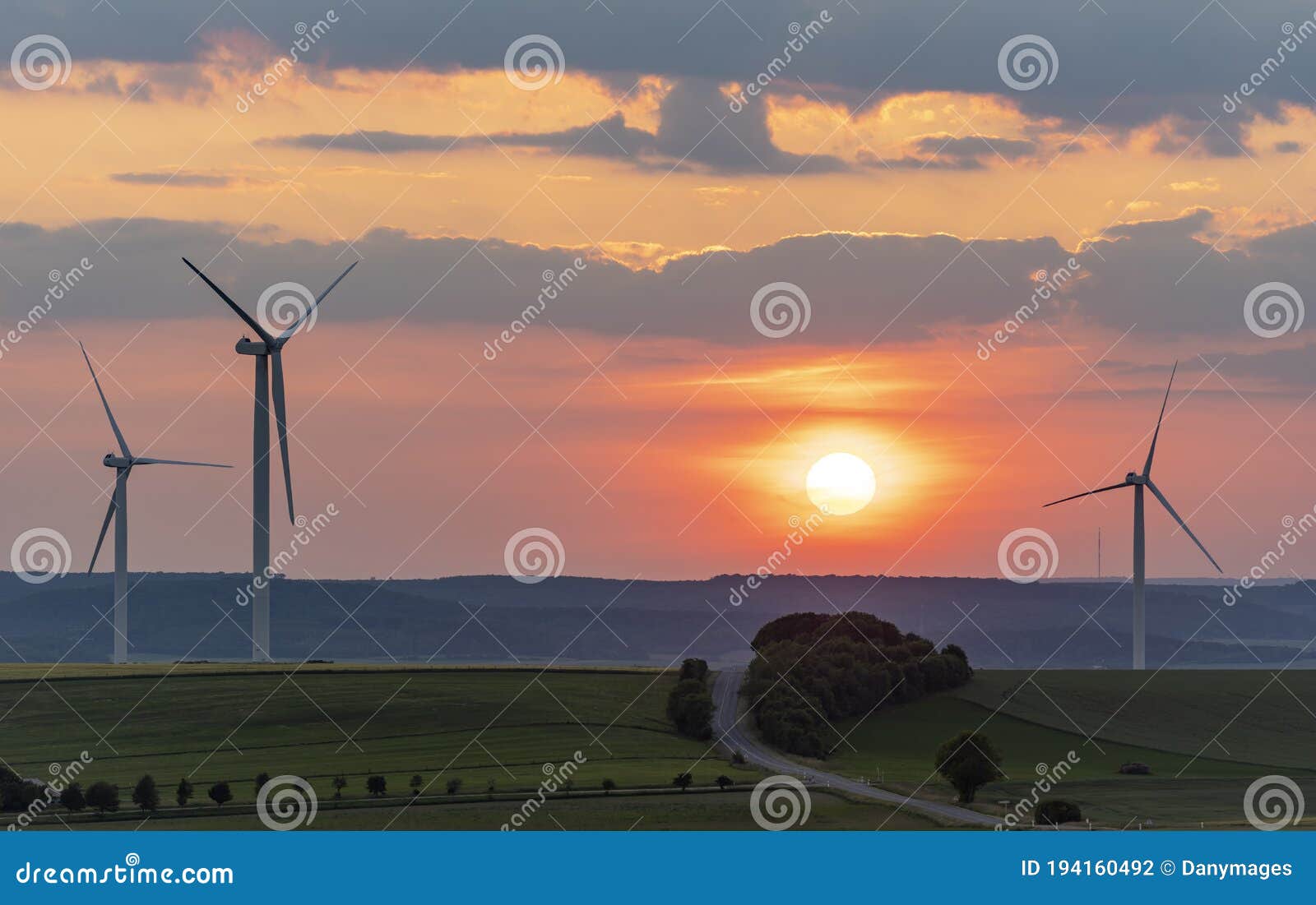 Wind farm in the sunset stock photo. Image of nature - 194160492