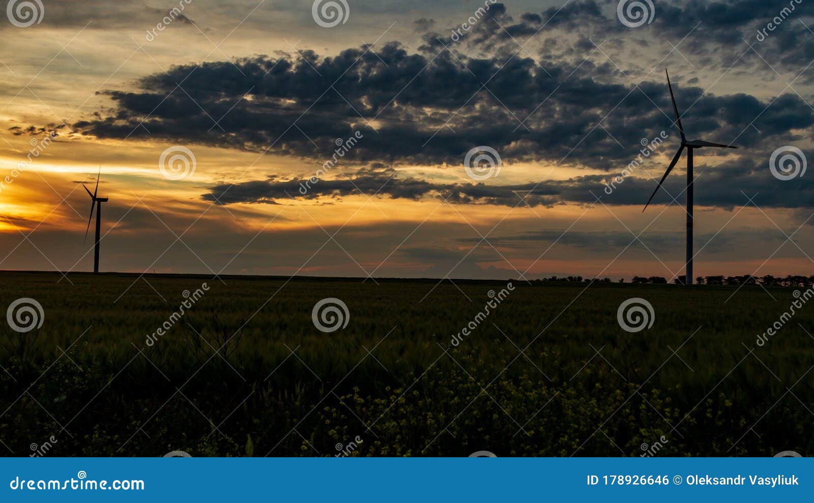 Wind Generator in Grass Field at Sunset Stock Photo - Image of ...