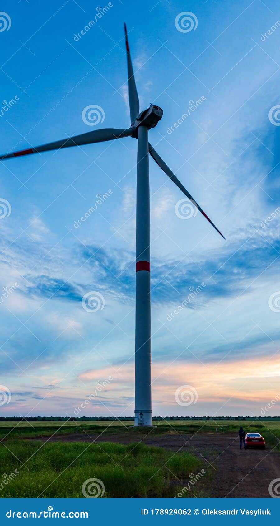 Wind Generator in Grass Field at Sunset Editorial Photography - Image ...