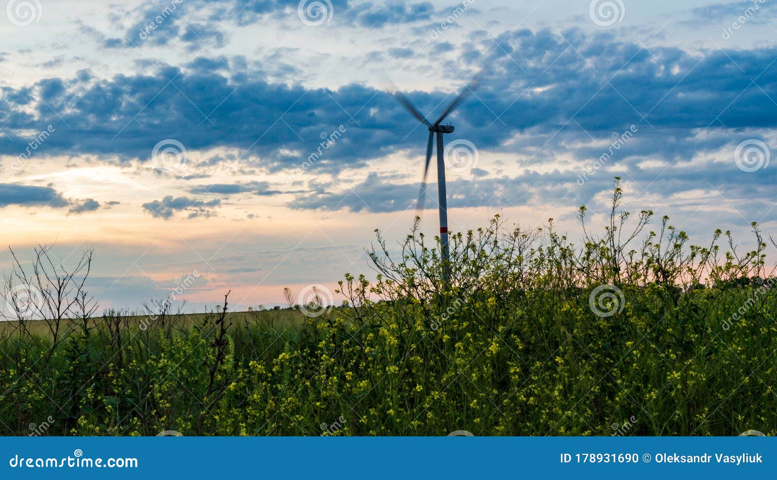 Wind Generator in Grass Field at Sunset Stock Photo - Image of ...