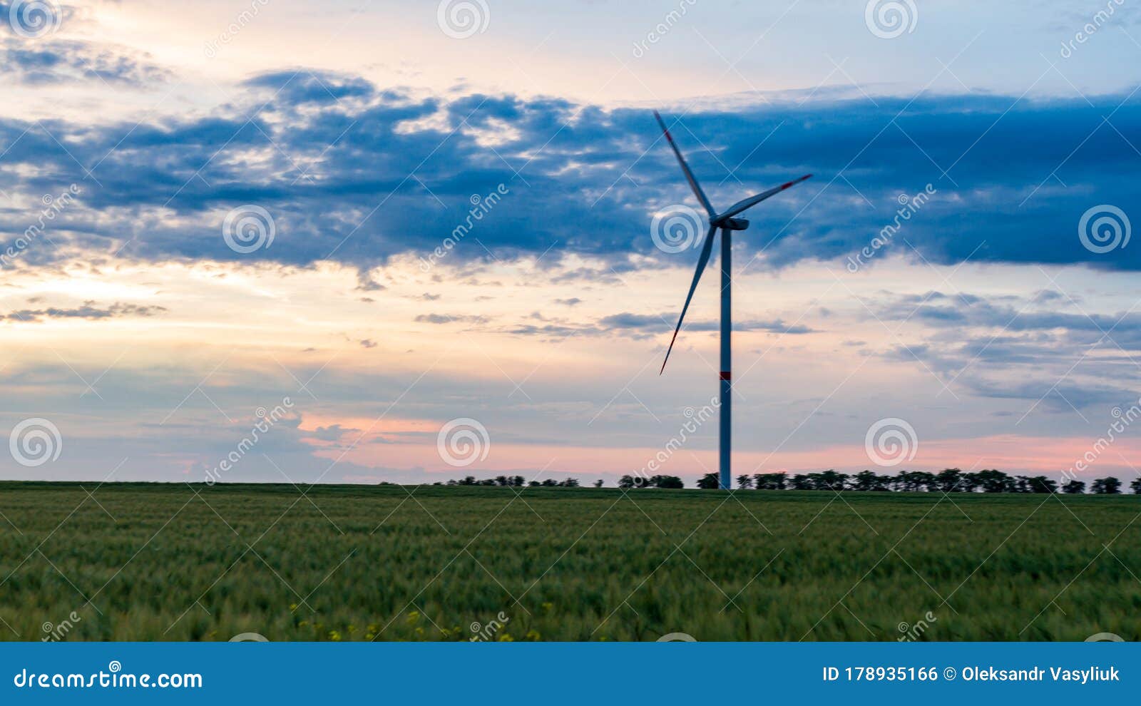 Wind Generator in Grass Field at Sunset Stock Photo - Image of clean ...
