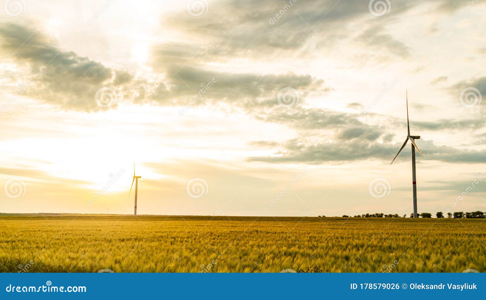 Wind Generator in Grass Field at Sunset Stock Photo - Image of ...