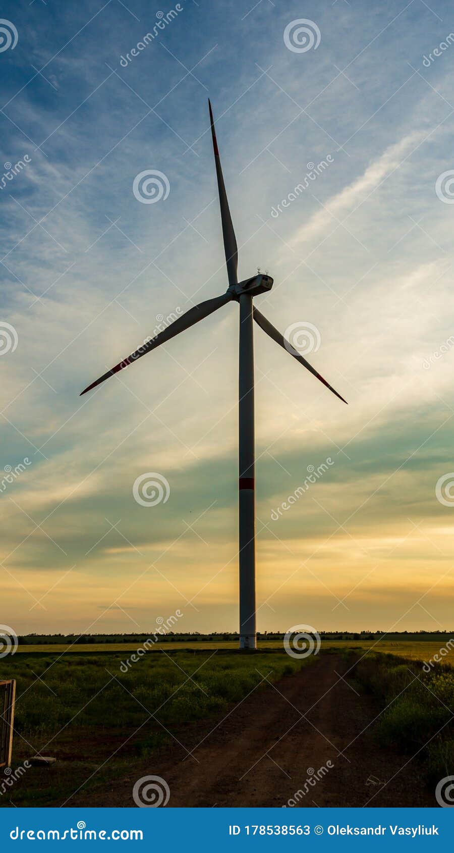 Wind Generator in Grass Field at Sunset Stock Image - Image of field ...