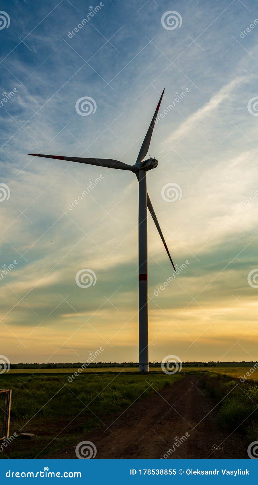 Wind Generator in Grass Field at Sunset Stock Image - Image of ...