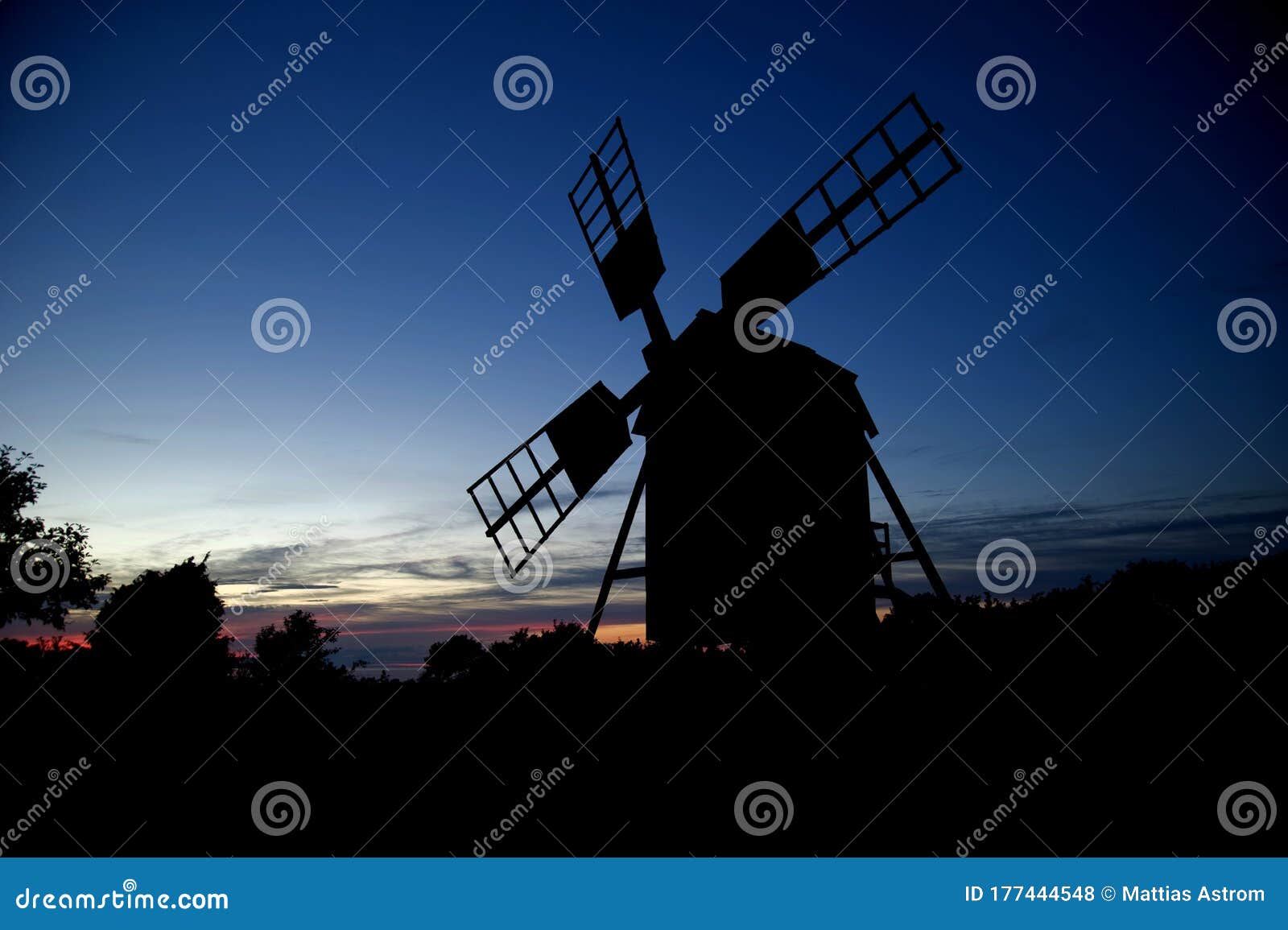 Wind mill in the sunset stock photo. Image of bluehour - 177444548