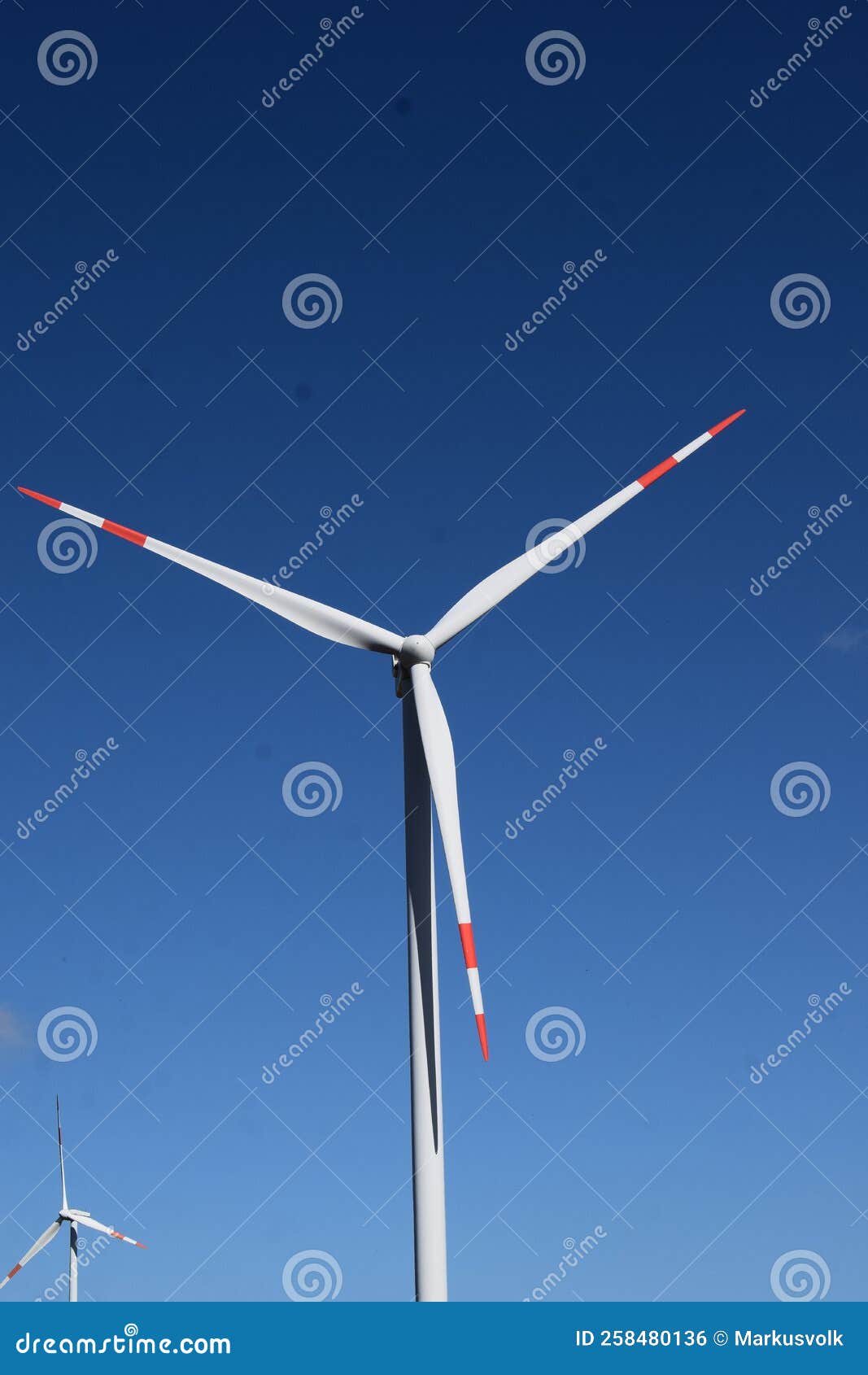 Wind Power Plant in Front of Blue Sky, with a Second One in the Corner ...