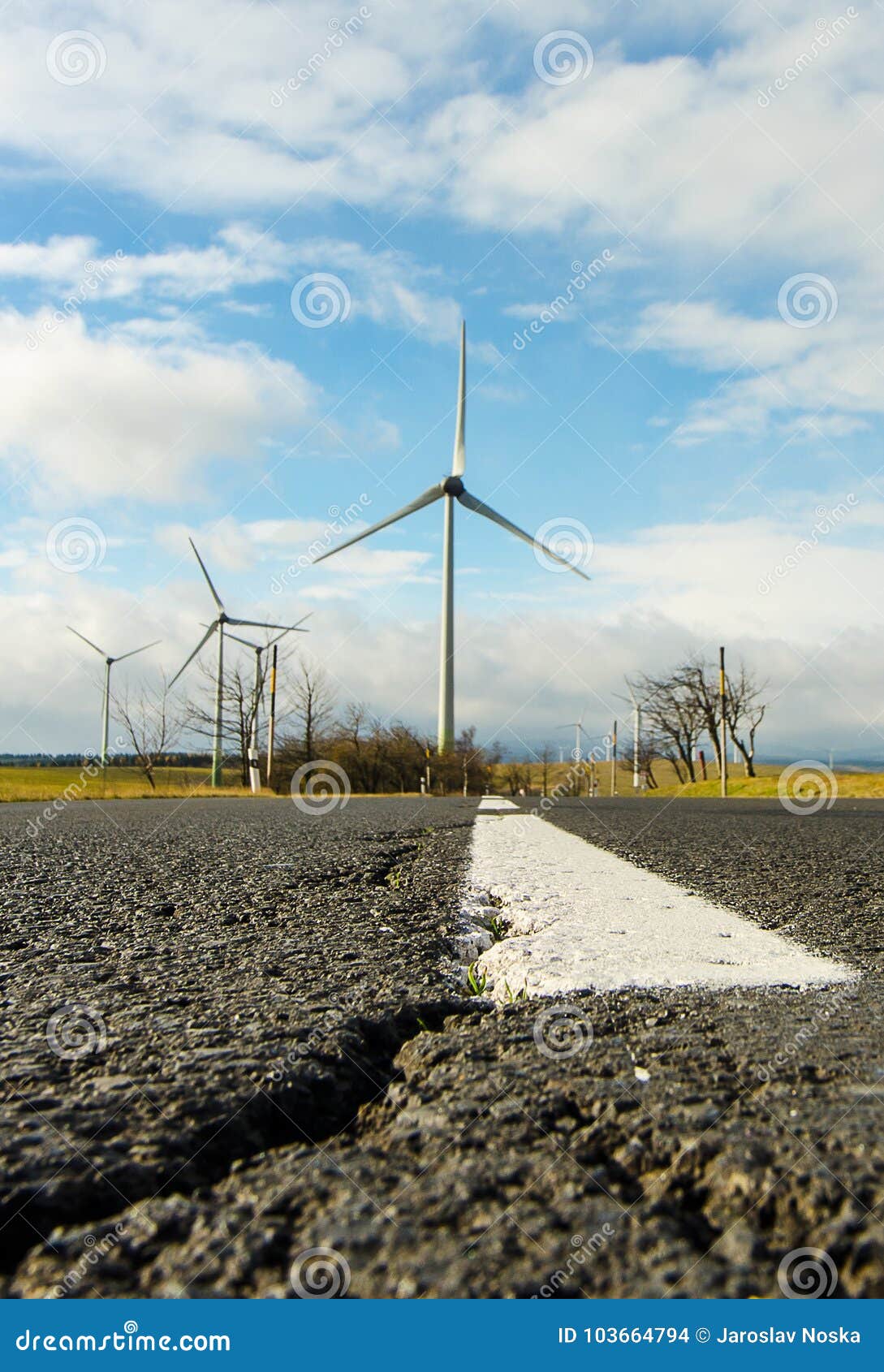 Wind turbine and road. stock photo. Image of conservation - 103664794