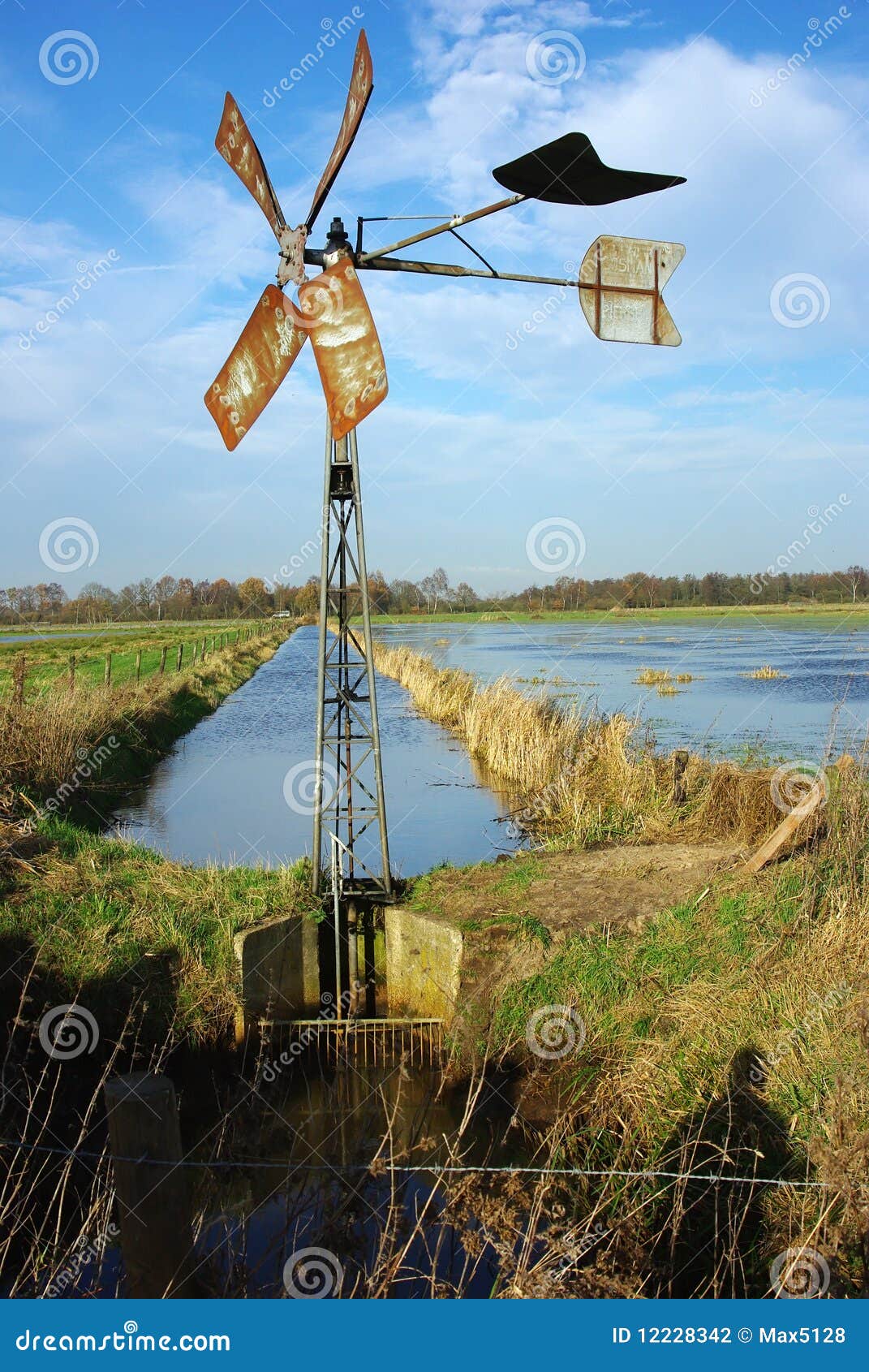 Wind pump stock photo. Image of vane, cast, driven, reservoir - 12228342