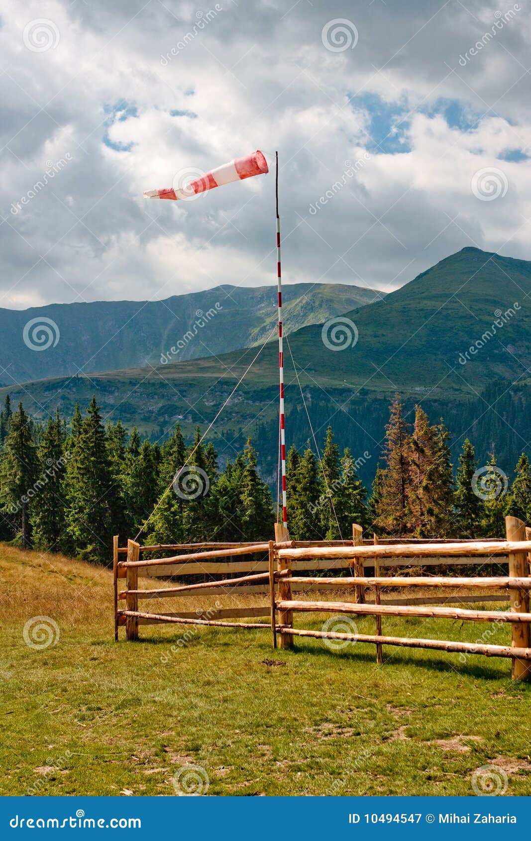 Wind sleeve and mountains stock image. Image of grass - 10494547