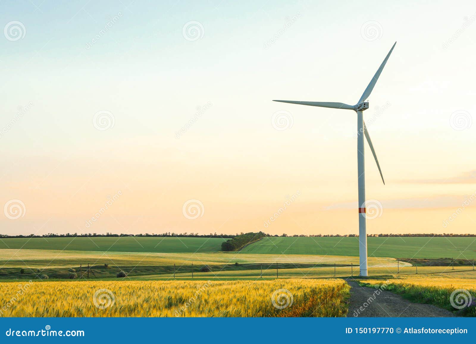 Wind Turbine and Beautiful Fields at Sunset Stock Photo - Image of ...