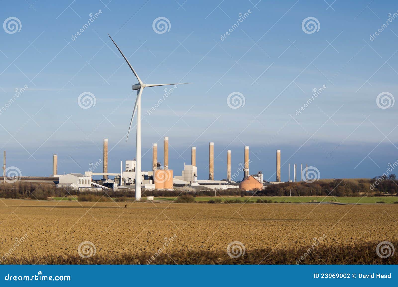 Wind turbine and factory stock photo. Image of rotate - 23969002