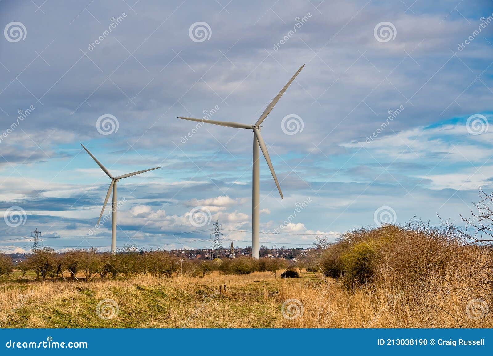 Wind turbine in a field stock photo. Image of plant - 213038190