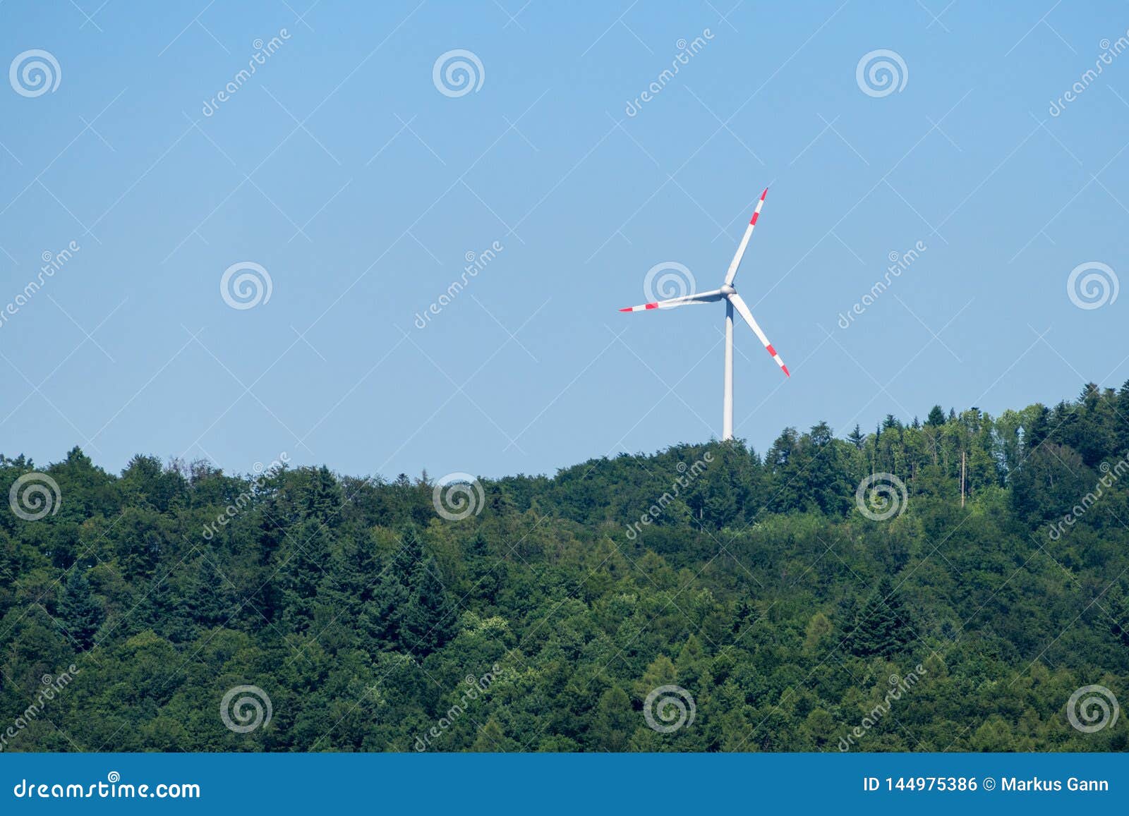 Wind turbine in the forest stock photo. Image of building - 144975386