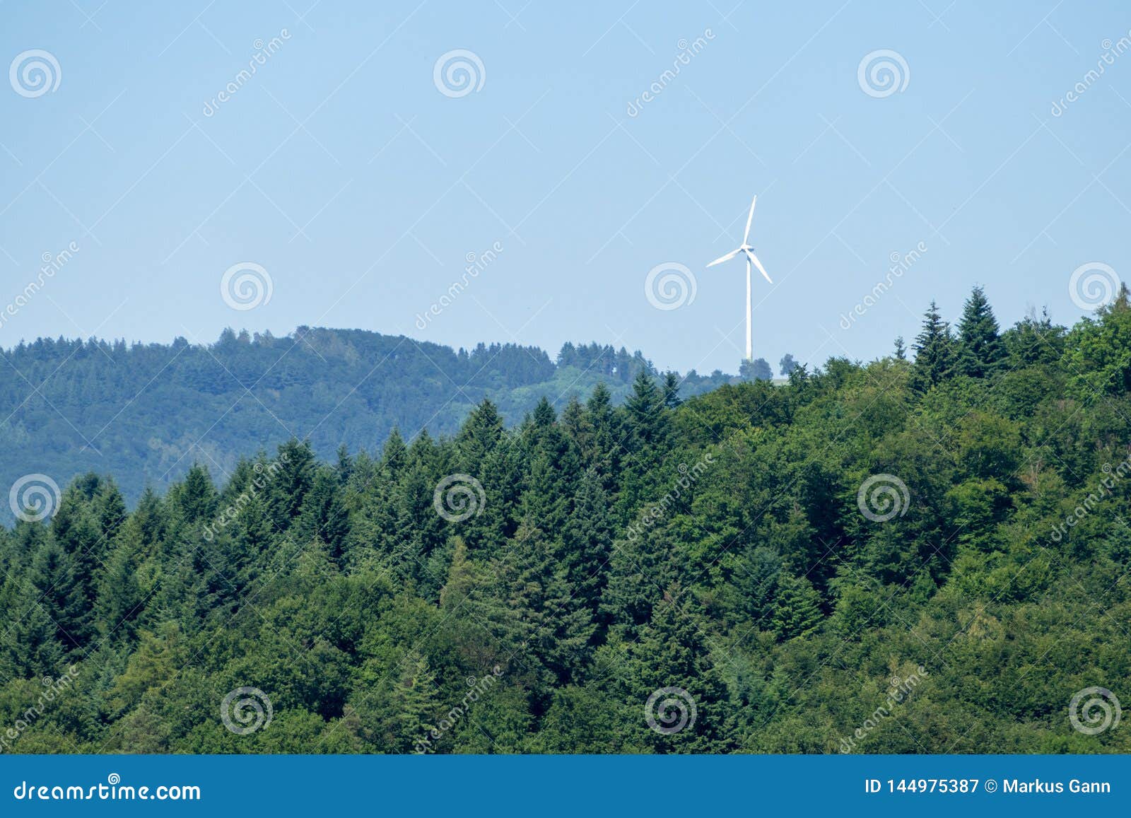 Wind turbine in the forest stock image. Image of summer - 144975387