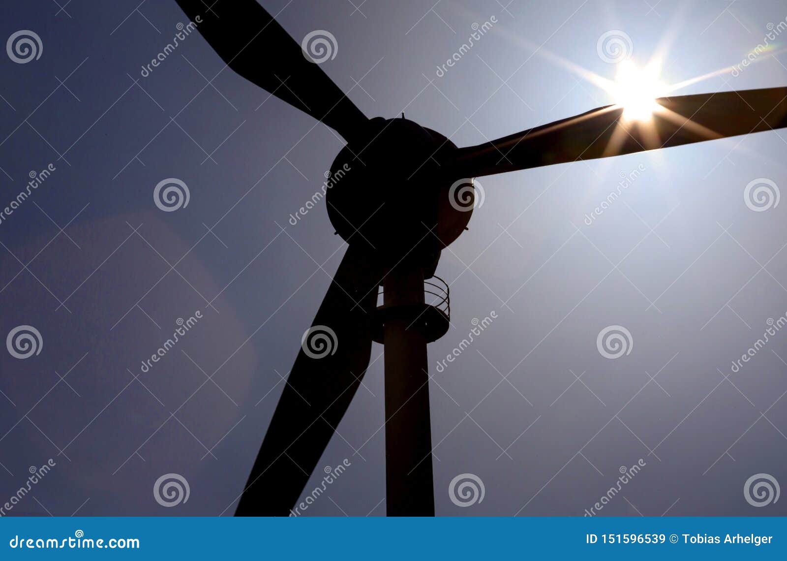 Wind turbine with sun rays stock image. Image of turbine - 151596539