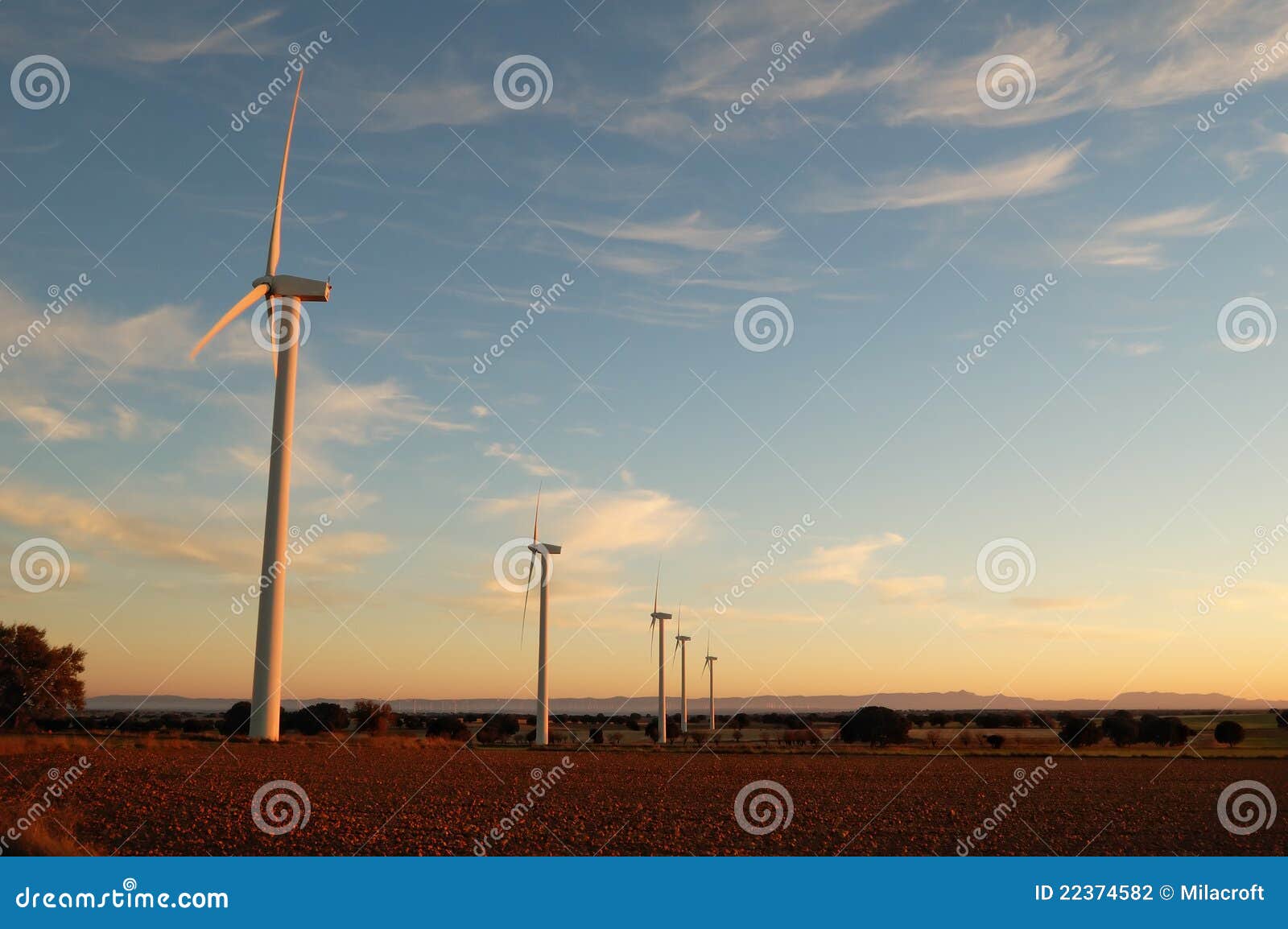 Wind turbine at sunset stock photo. Image of environmental - 22374582