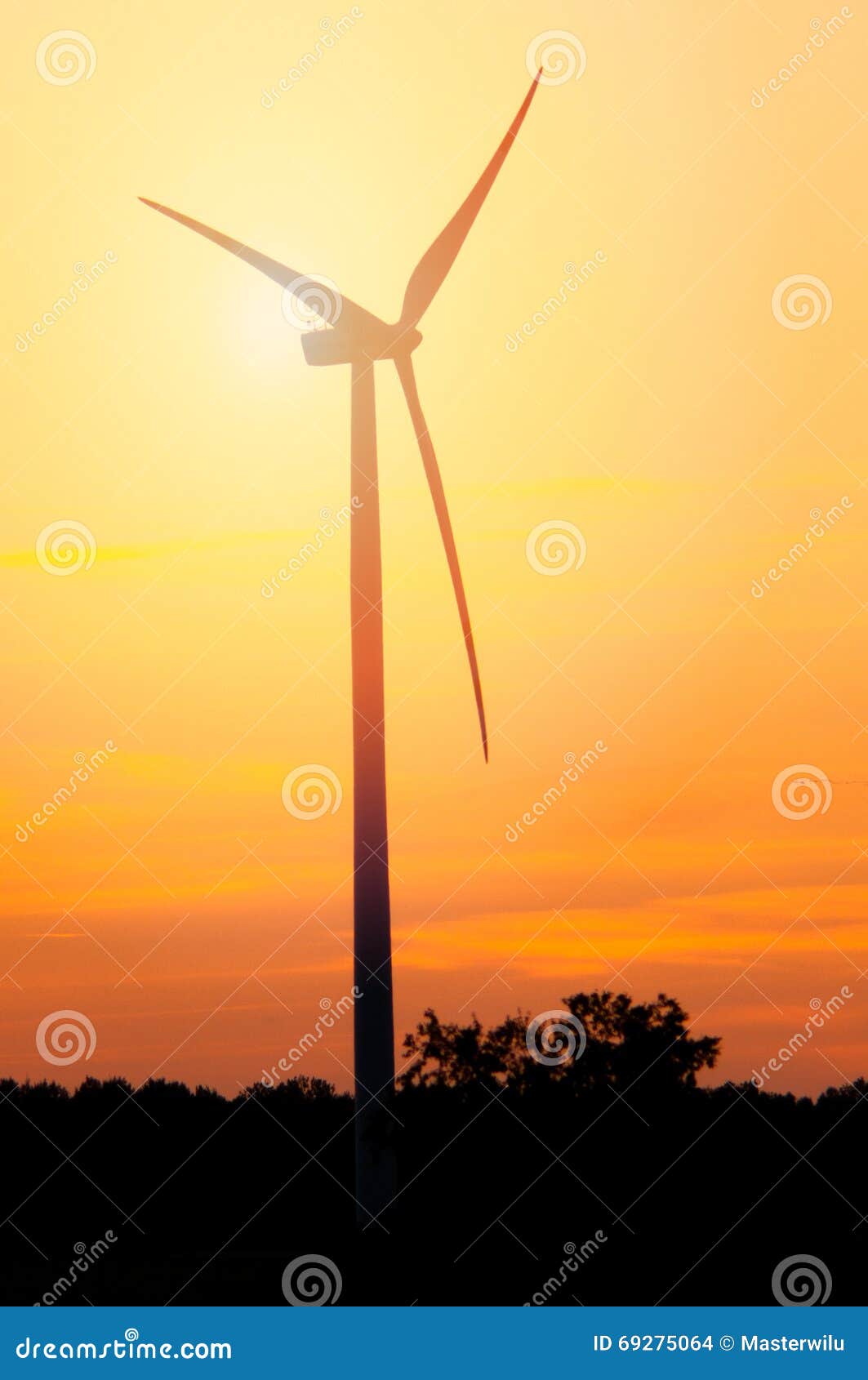 Wind turbine at sunset stock photo. Image of environment - 69275064