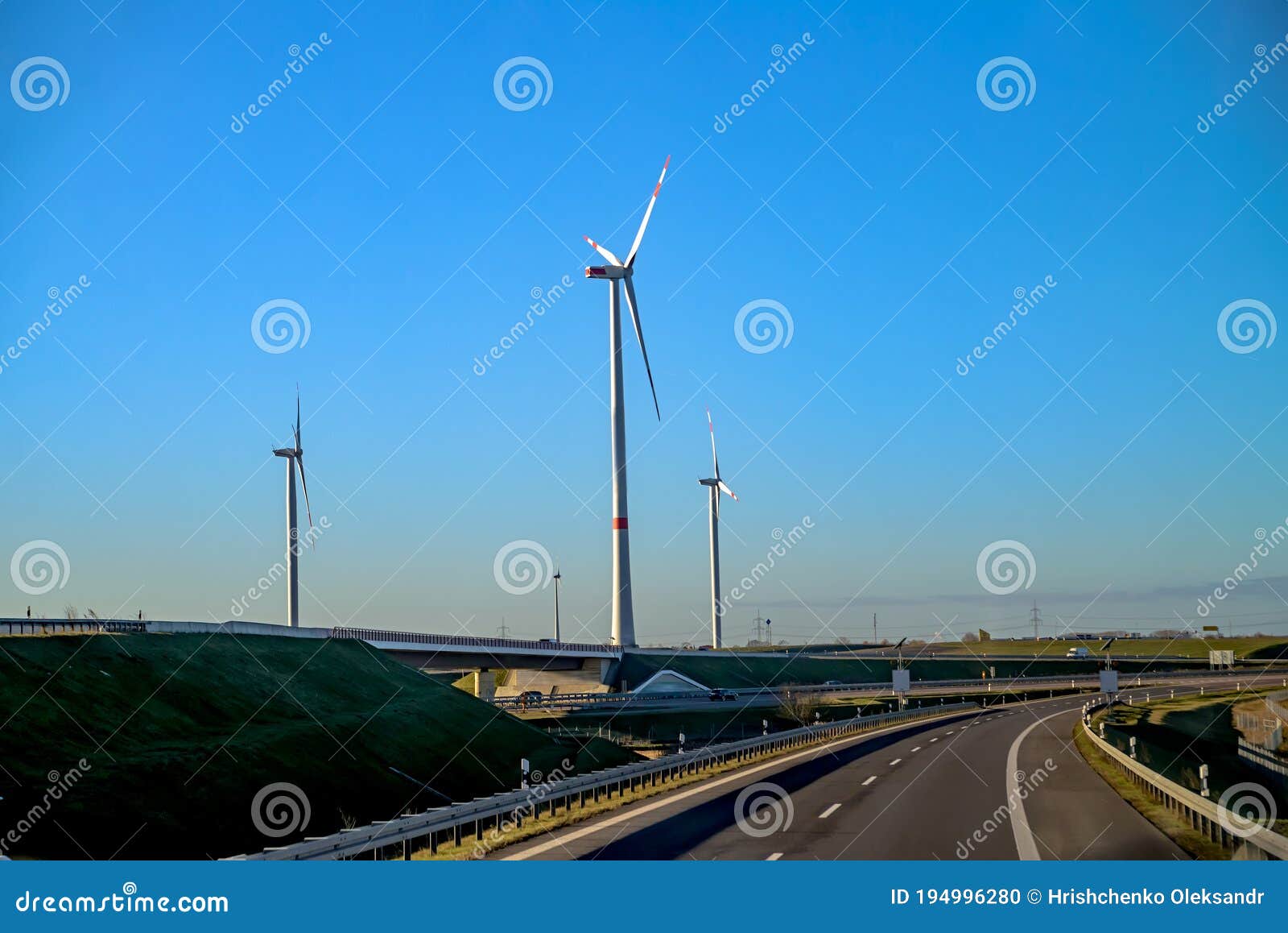 Wind Turbines Along the Roadway Stock Photo - Image of technology, mill ...