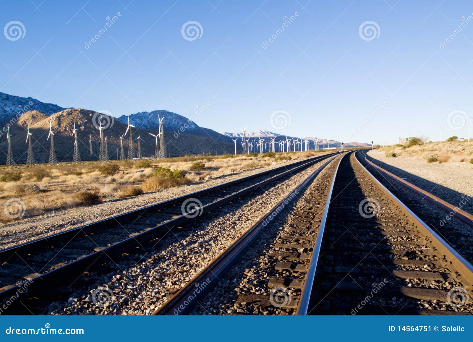 Wind turbines along tracks stock image. Image of wind - 14564751