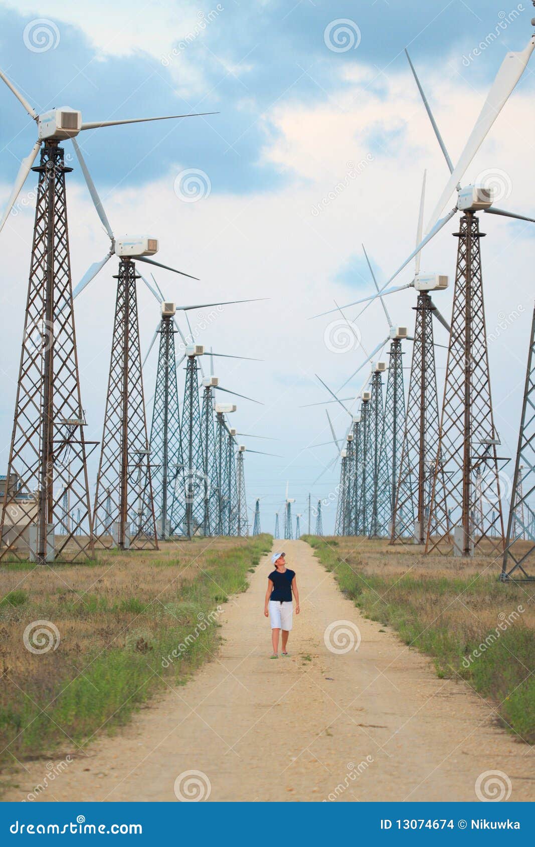 Wind Turbines Farm and Walking Person Stock Photo - Image of ...