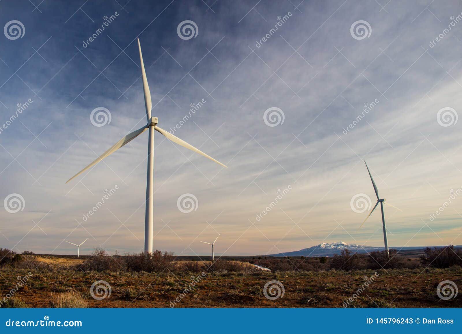 Wind Turbines at a High Elevation Prairie Landscape with Mountains in ...