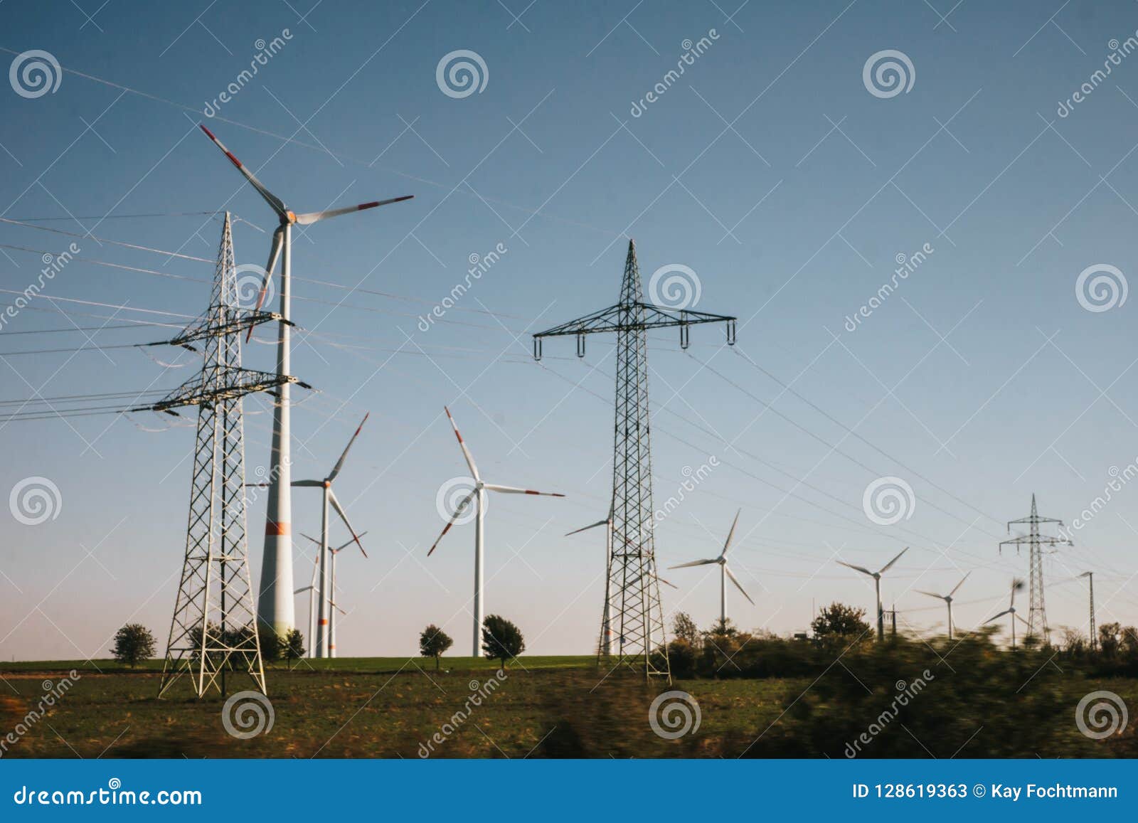 Wind Turbines and Power Lines on a Field Stock Image - Image of ...