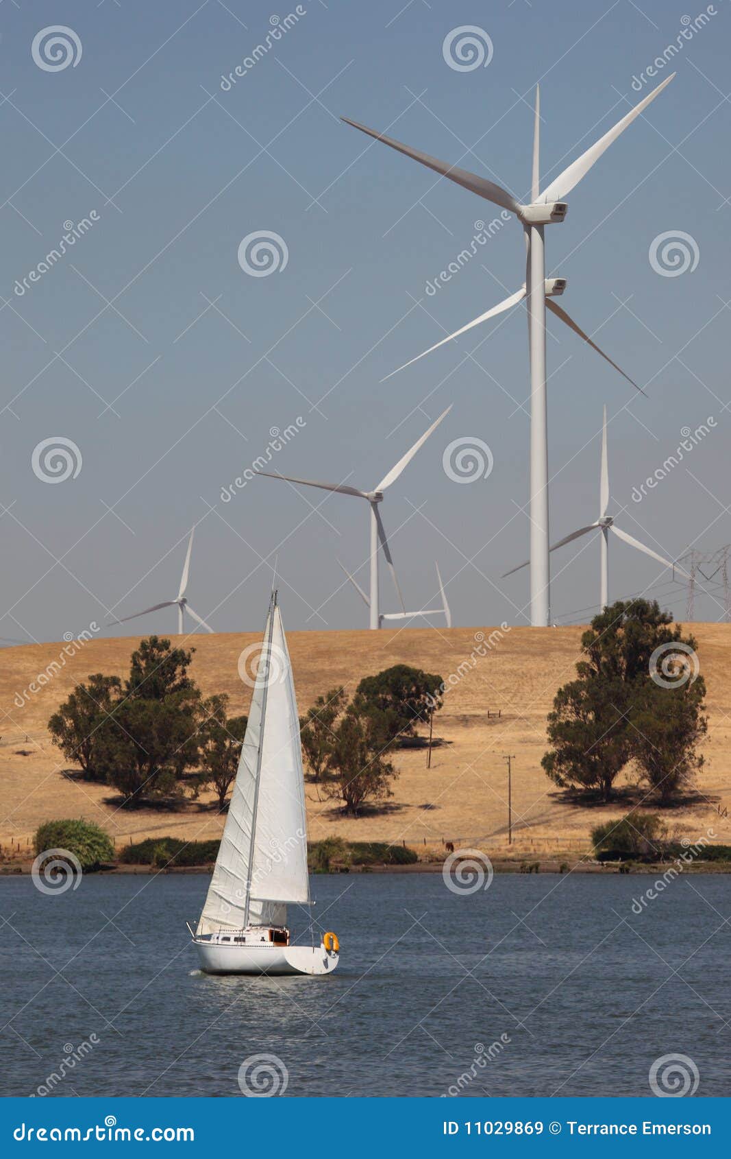 Wind Turbines and Sailboat stock image. Image of hills - 11029869