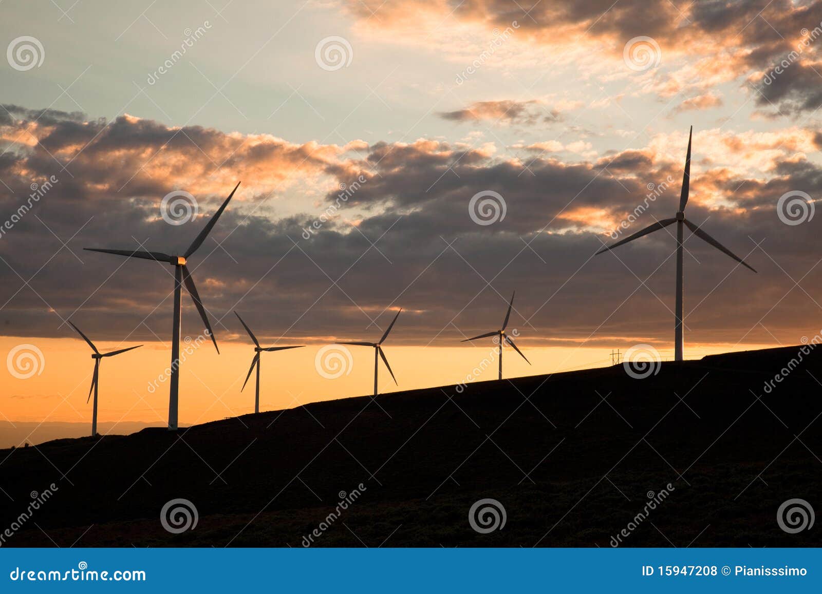 Wind turbines at sunset stock photo. Image of sunset - 15947208