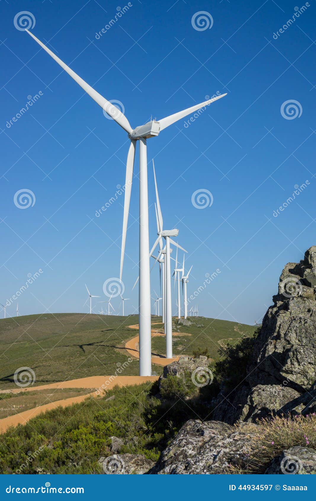 Wind Turbines, Track and Rocks in the Countryside Stock Image - Image ...