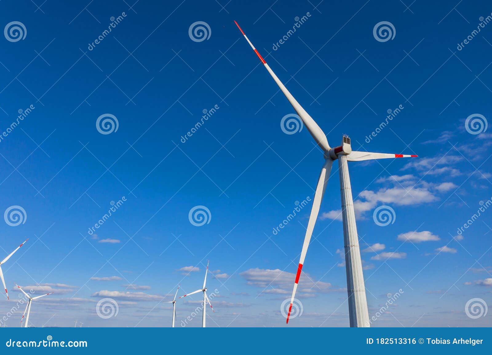Wind Wheels in Front of a Bright Cloudscape Stock Photo - Image of ...