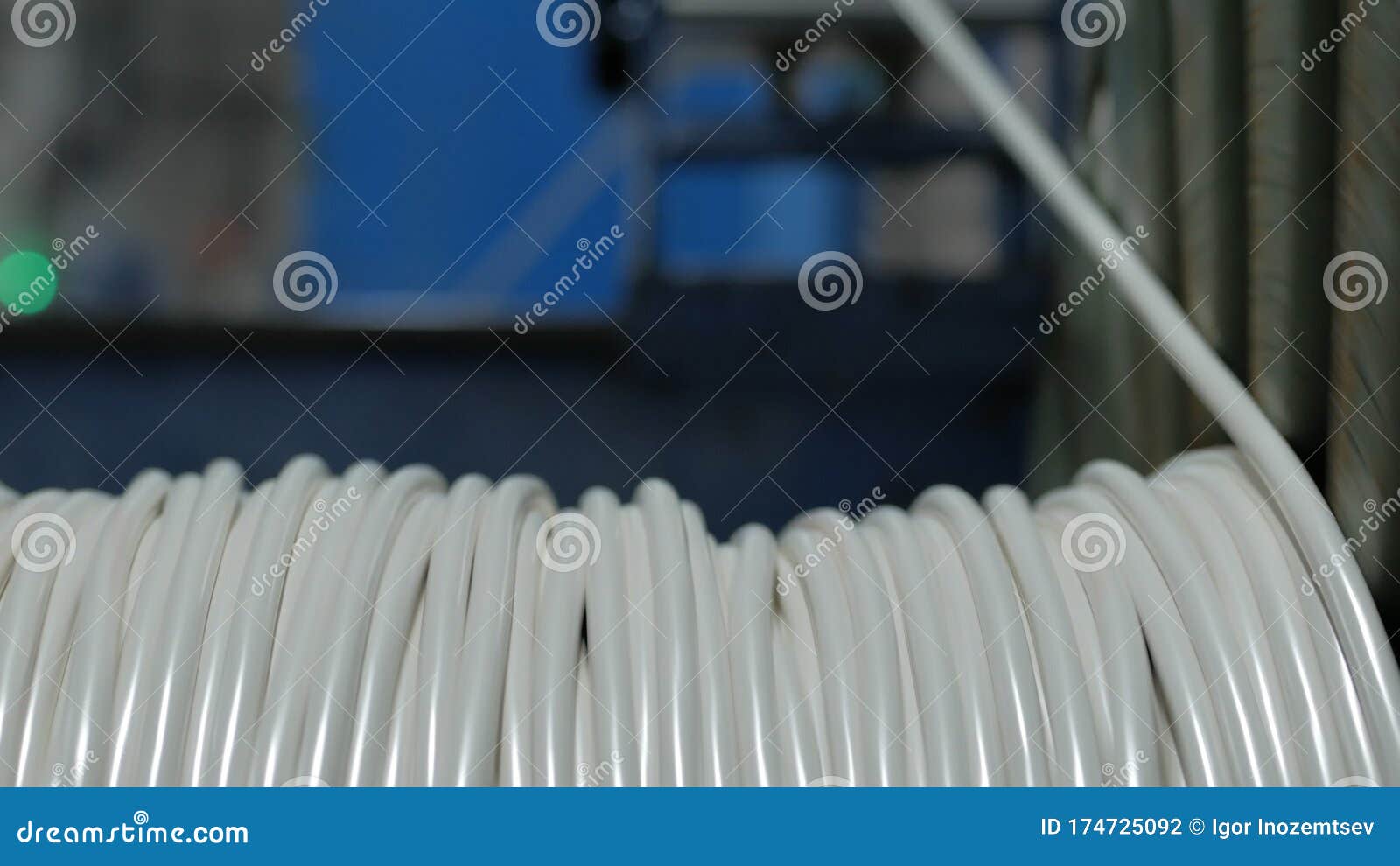 Winding Cable on a Rotating Coil. Production of Electric Cable. Stock ...