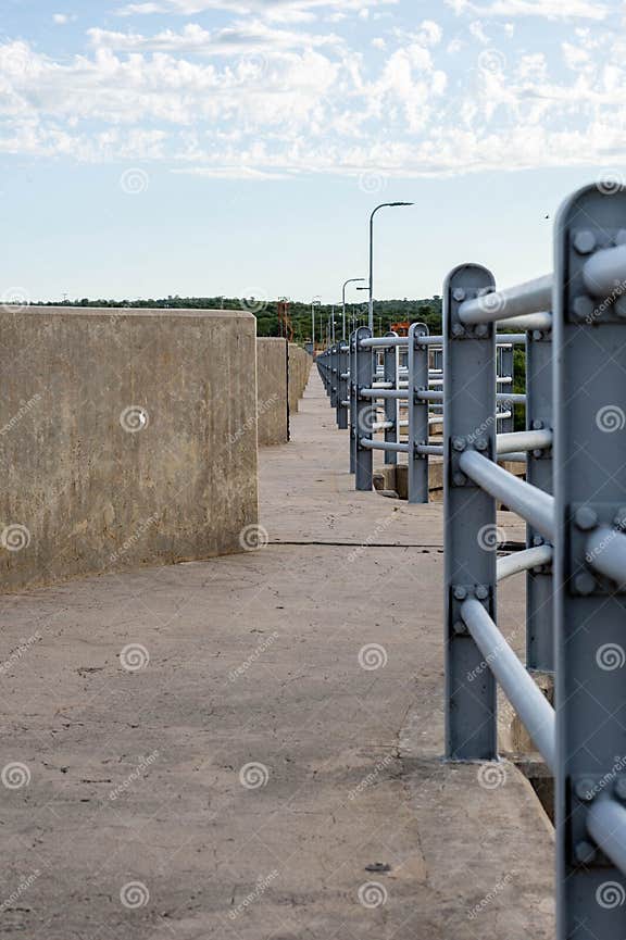 Winding Curvy Pathway Lined with a Metallic Fence Stock Image - Image ...