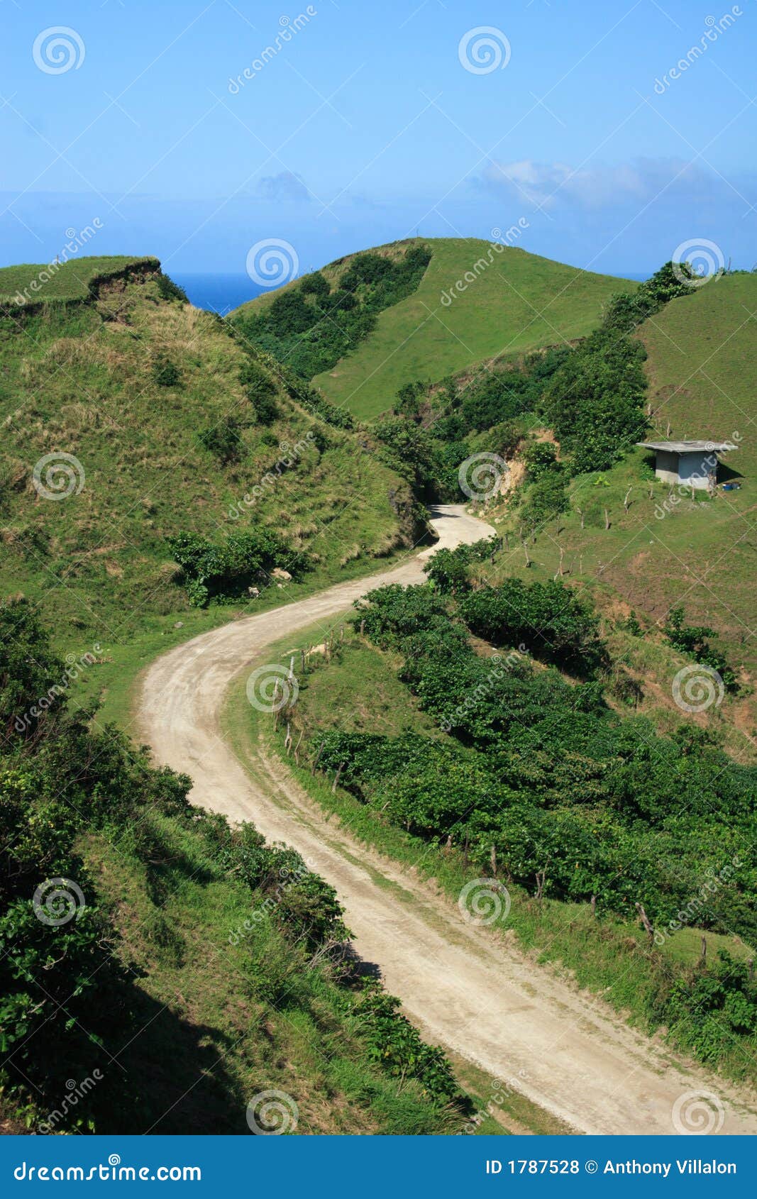 Winding dirt road stock photo. Image of blue, hills, scenery - 1787528