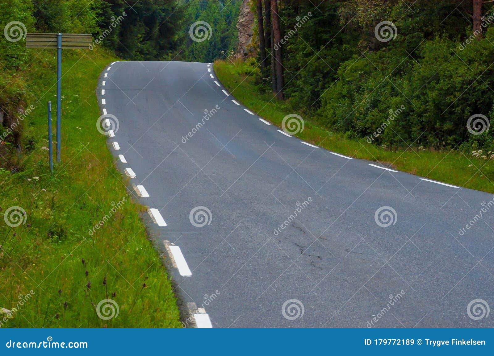 A Winding Road Over a Crest Stock Image - Image of blue, landscape ...