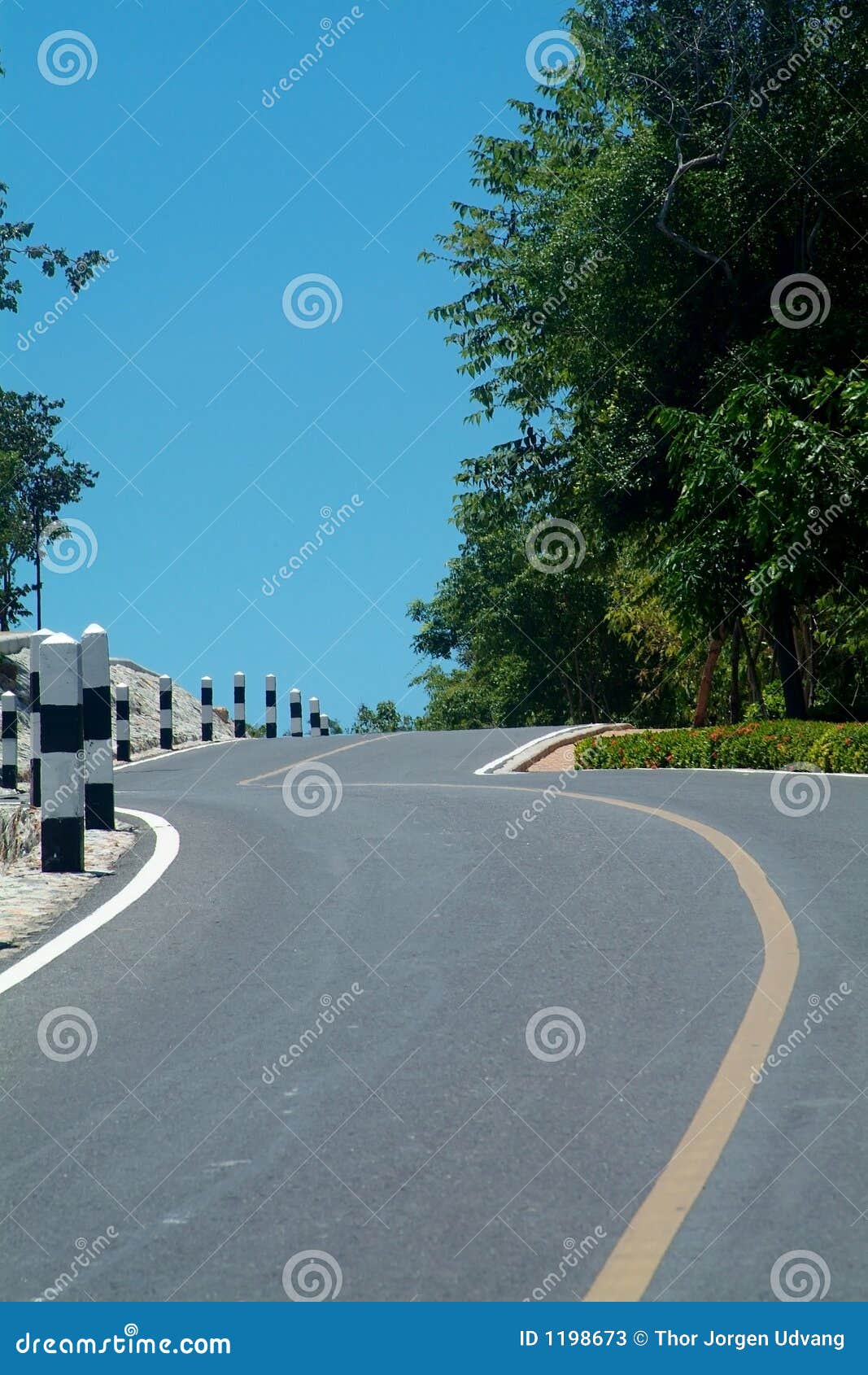 Winding road over a hill stock image. Image of thailand - 1198673