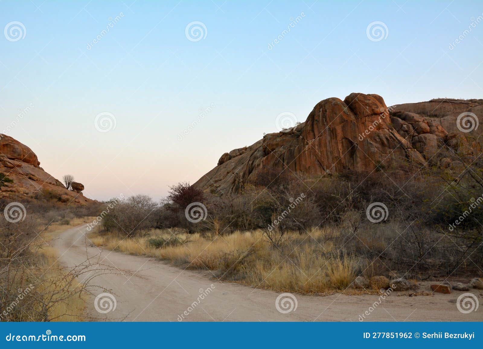 A Road in Perspective between Stone Blocks in the Desert. Drought and ...