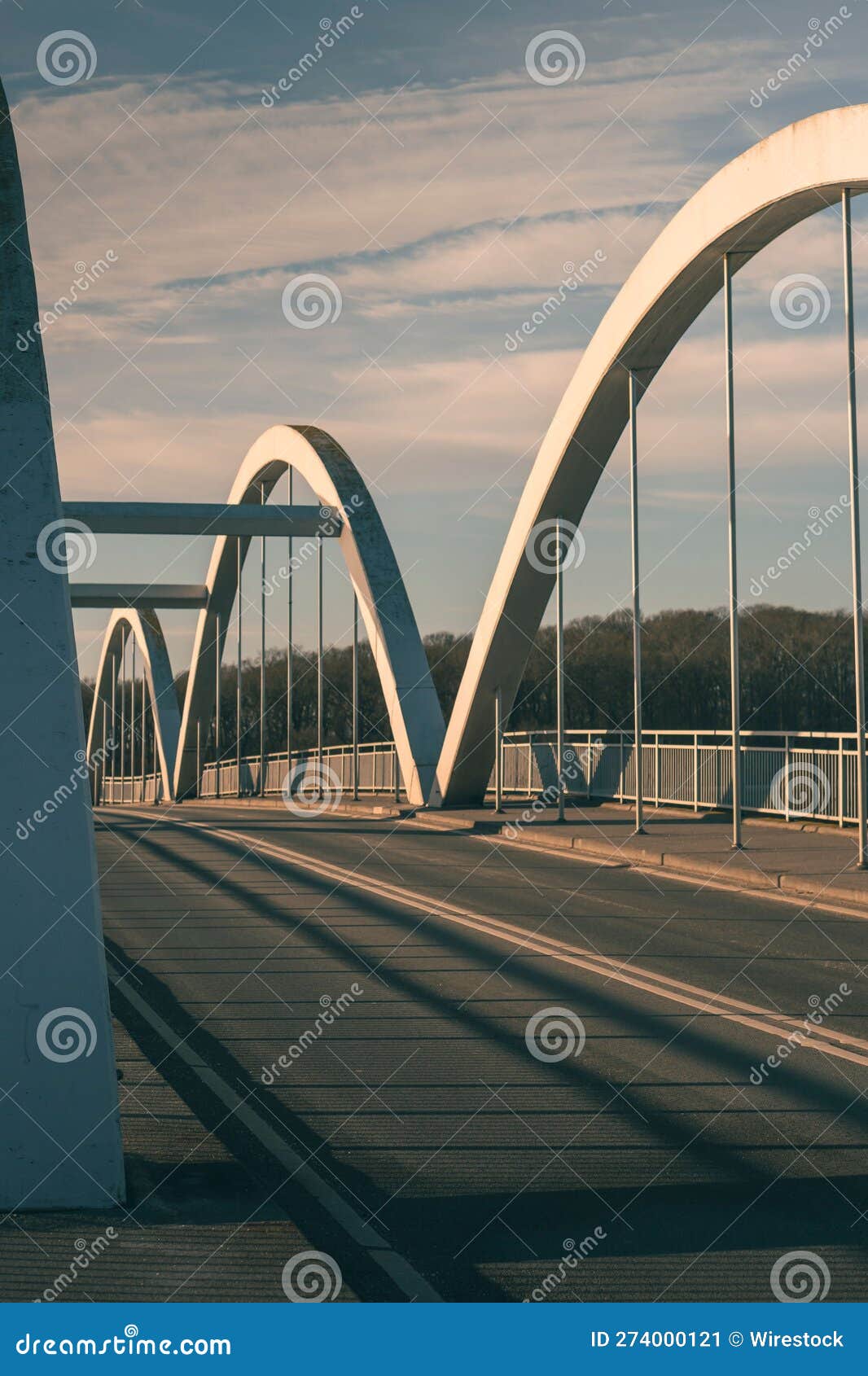 Winding Road Stretches Across an Arched Bridge at Sunset Stock Image ...