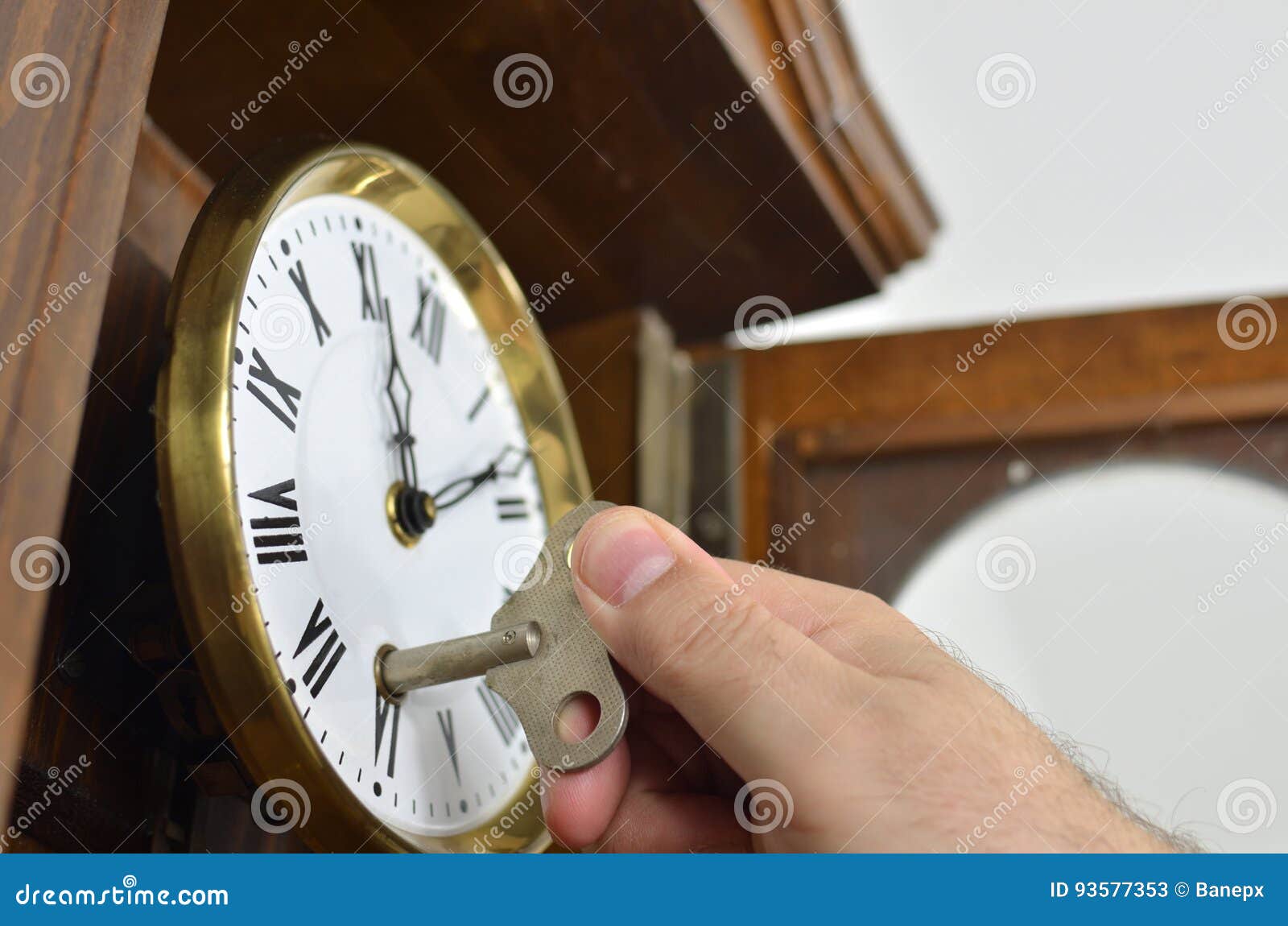Winding a Wall Clock stock image. Image of classical - 93577353