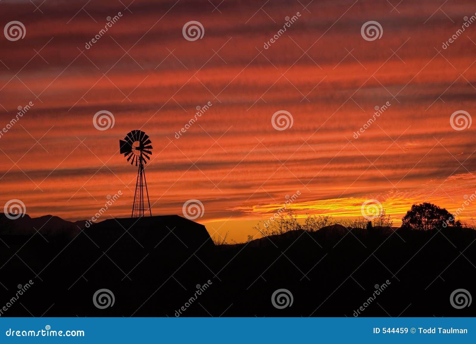 Windmill in an Arizona Sunset Stock Image - Image of yellow, manmade ...